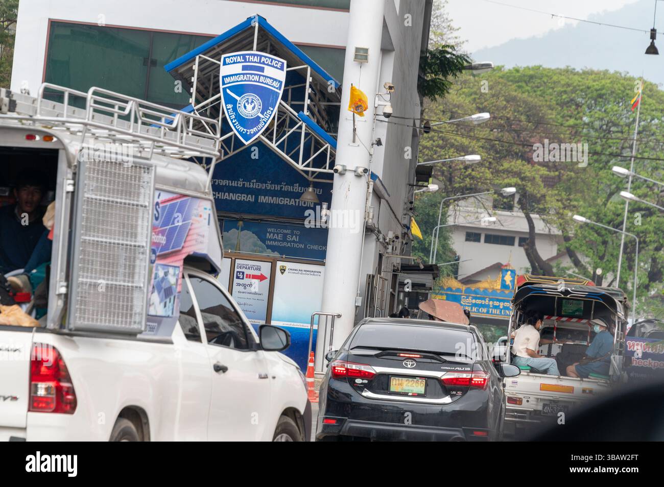 At the busy entrance of the main border crossing between Mae Sai in ...