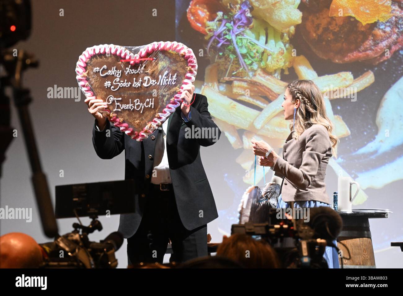 Munich, Germany. 13th May, 2025. Influencer Cathy Hummels (r) on stage ...