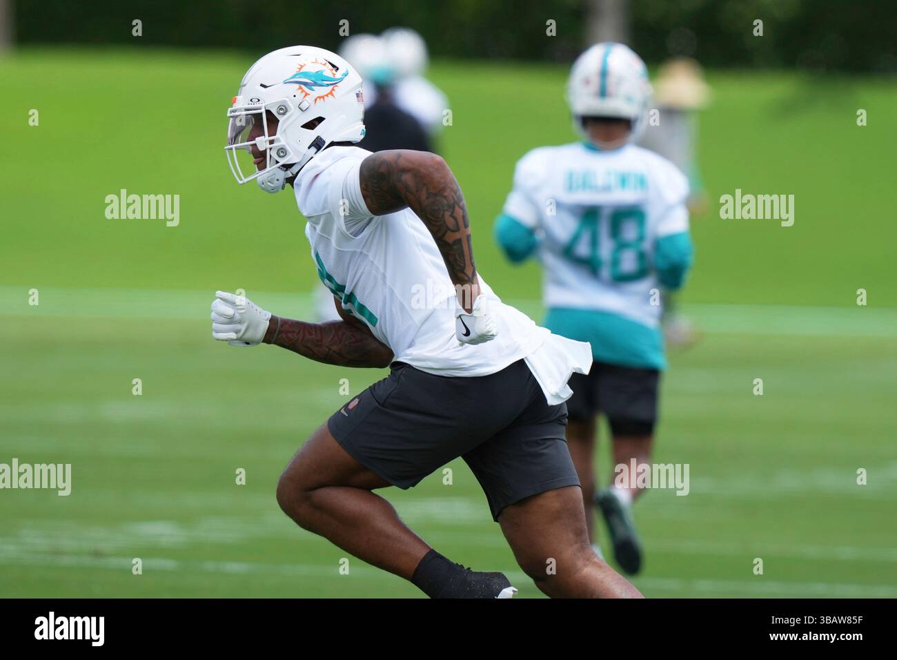 Miami Dolphins running camp Ollie Gordon II runs drills during the NFL ...