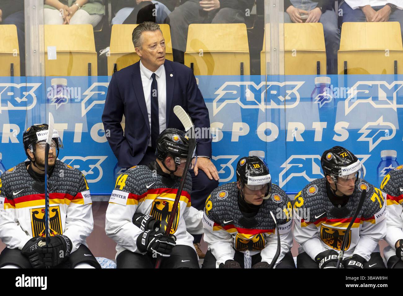 Harold Kreis, head coach of Germany national ice hockey team, observes ...