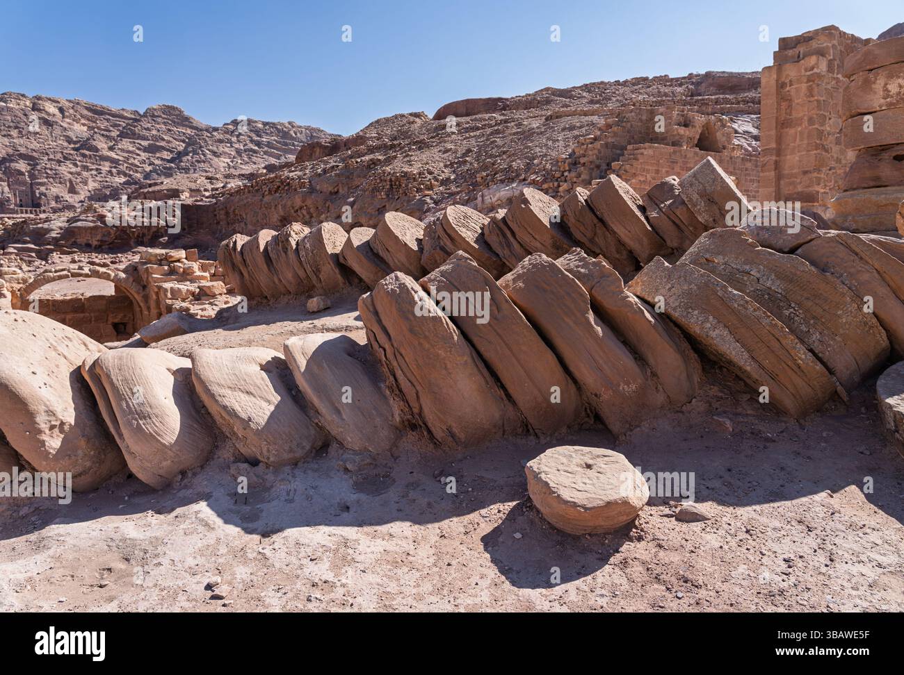 Massive round stone sectionsof a collapsed column at the Great Temple ...