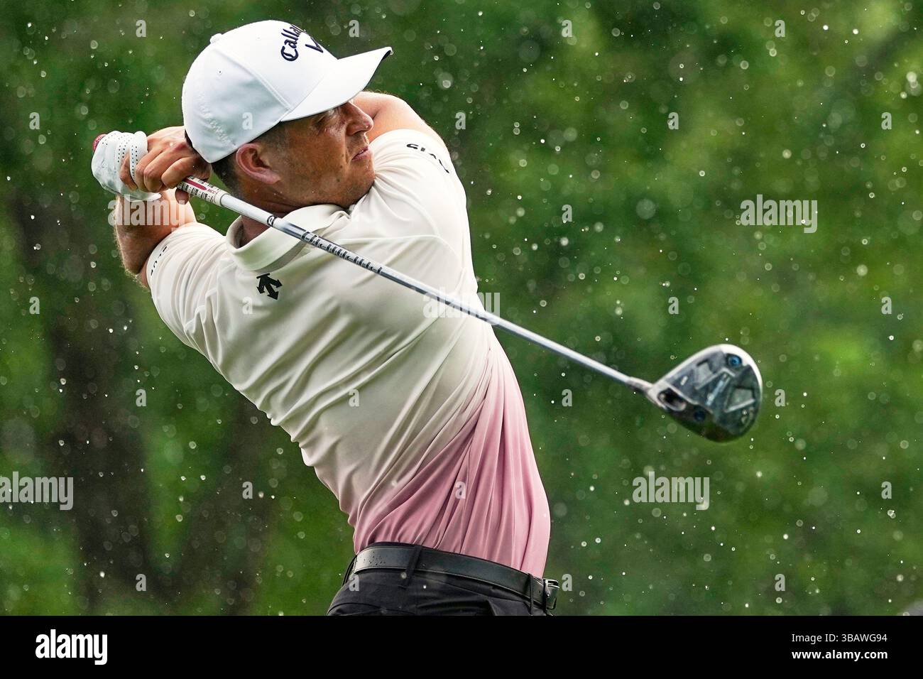 Xander Schauffele watches his tee shot on the ninth hole during a ...