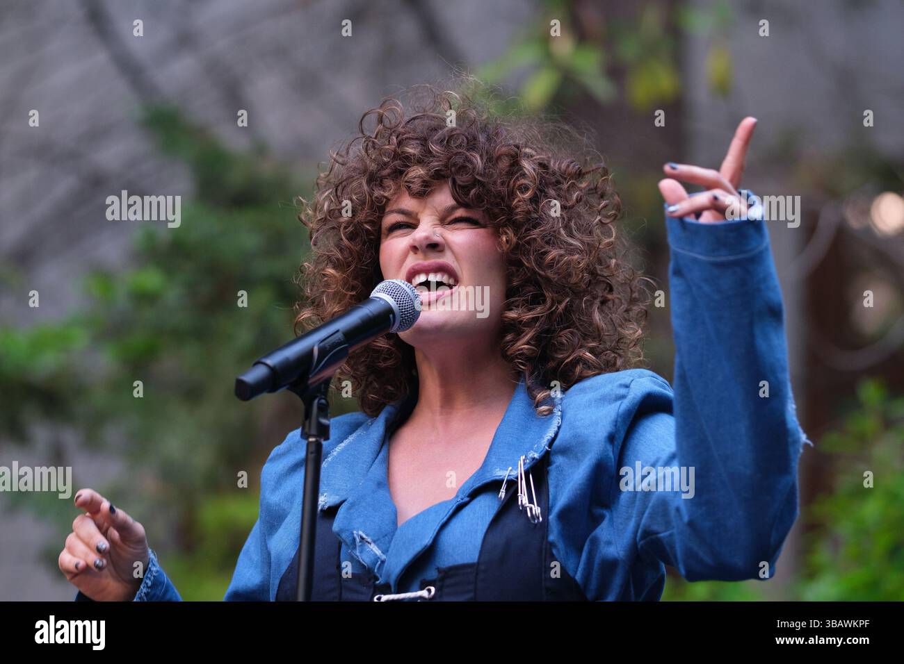 Singer Mel Omana performs during the tribute event to the song ...