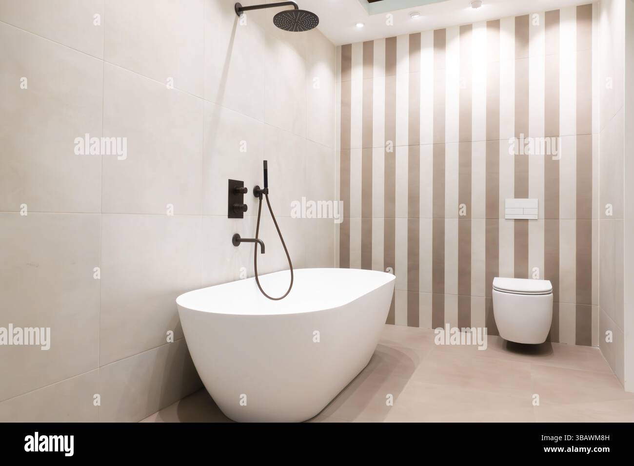Elegant and luxurious bathroom design with large gray stone tiles, a ...