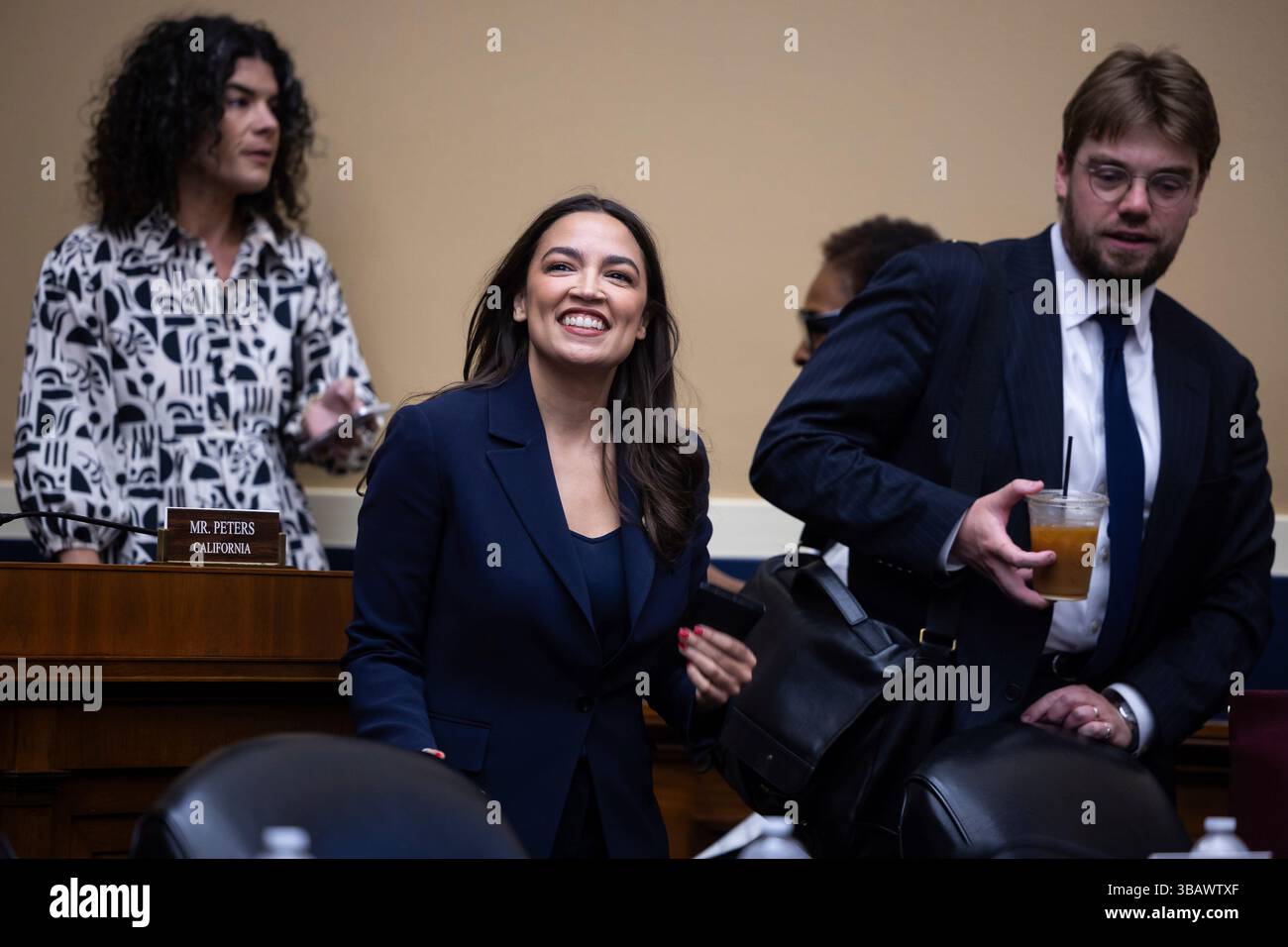 Rep. Alexandria Ocasio-Cortez (D-N.Y.) arrives for a House Energy and ...