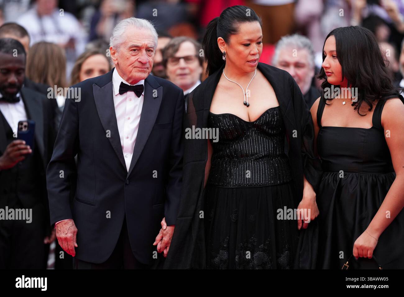 Robert De Niro, from left, Tiffany Chen, and Helen Grace De Niro pose for photographers during ...