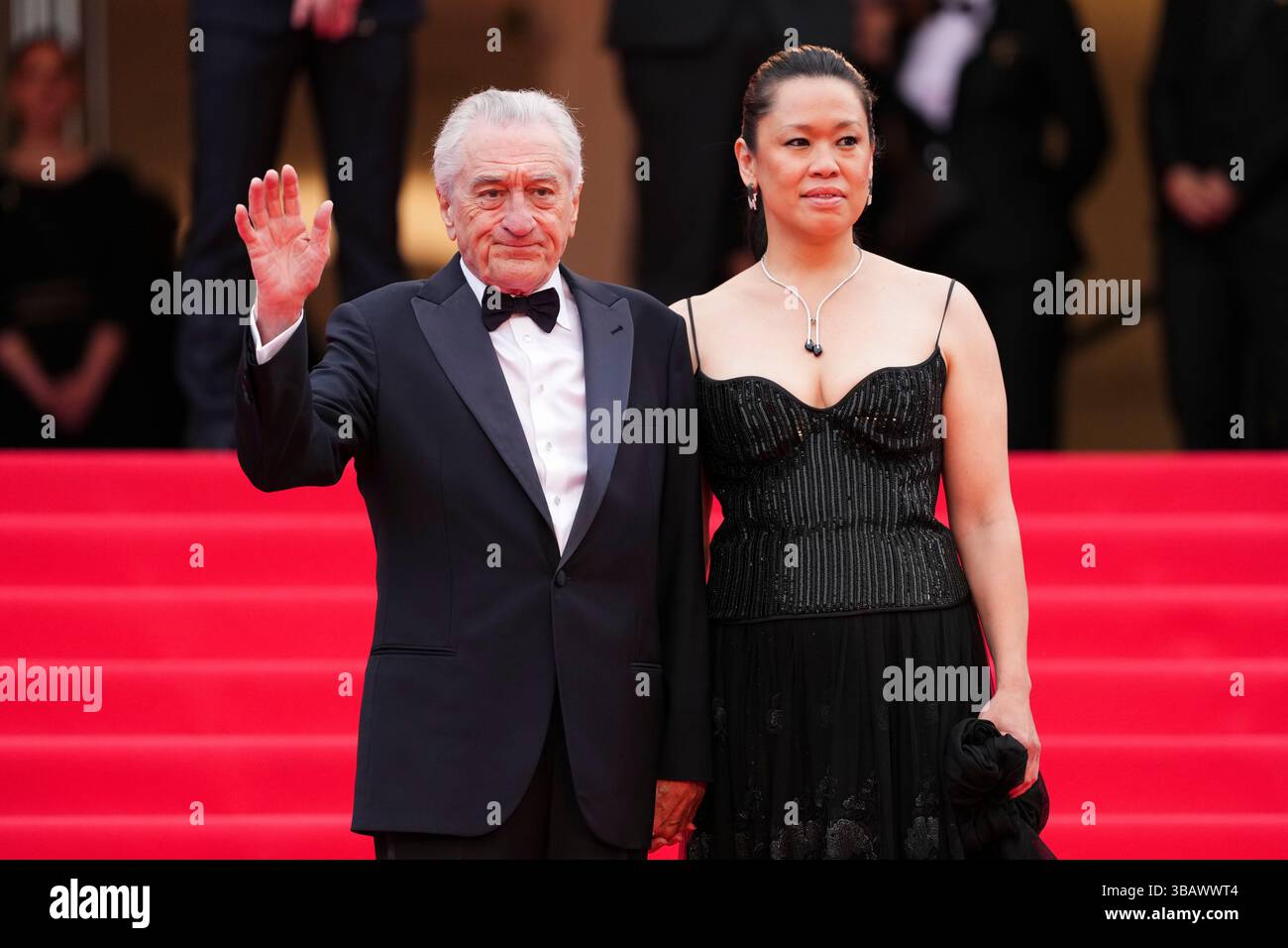Robert De Niro, left, and Tiffany Chen pose for photographers during the opening ceremony of the ...