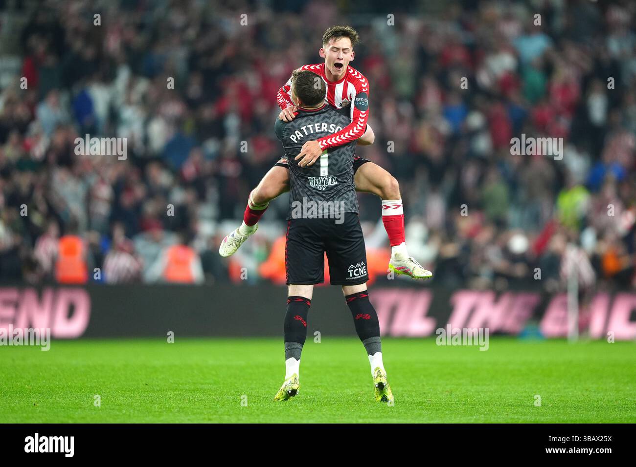 Sunderland goalkeeper Anthony Patterson (left) lifts up team-mate Chris ...