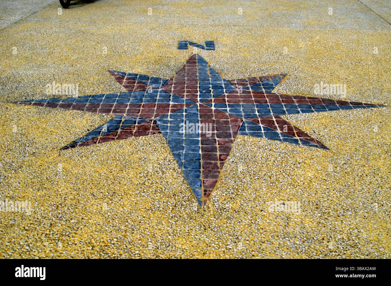 La Palmyre, France - May 01, 2025: Colorful mosaic compass rose design ...
