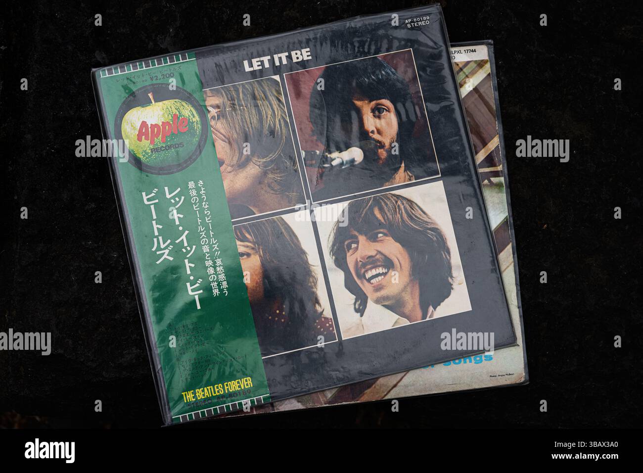 Lviv, Ukraine - May 13, 2025: Classic Let It Be 1970 album cover featuring The Beatles, a ...