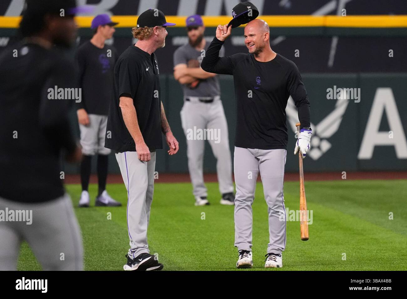 Colorado Rockies interim manager Warren Schaeffer, right, smiles on the ...