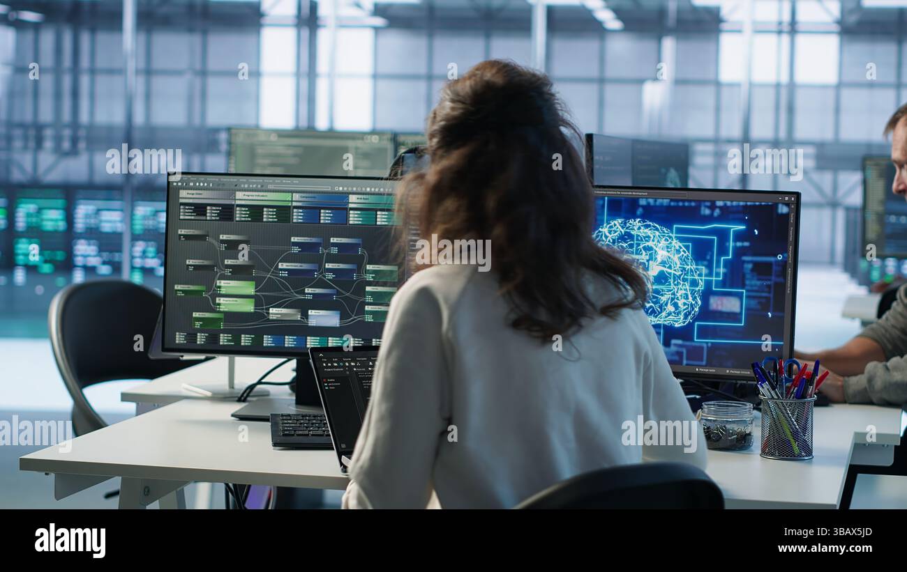 IT employee programming in AI server farm housing advanced equipment used for machine learning ...