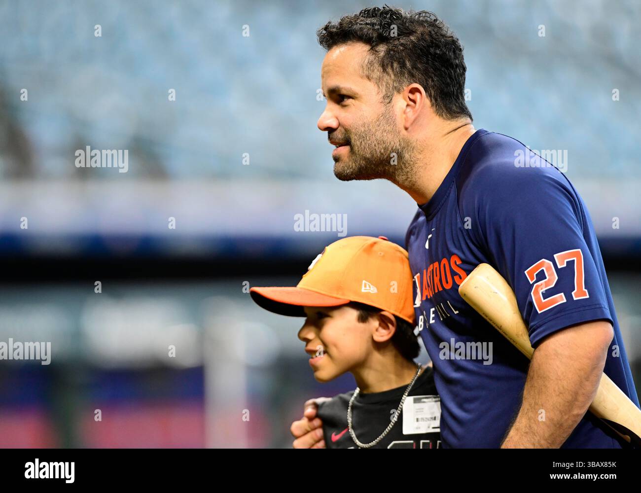 Houston Astros left field Jose Altuve (27) poses with a young fan ...