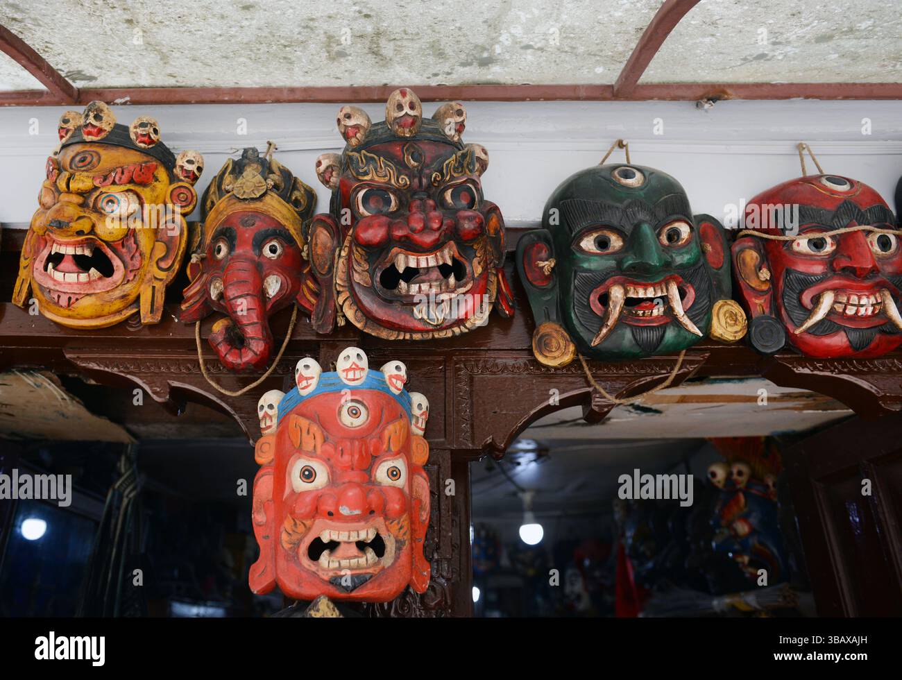 Traditional Tibetan wooden masks displayed at a shop on Freak Street in ...