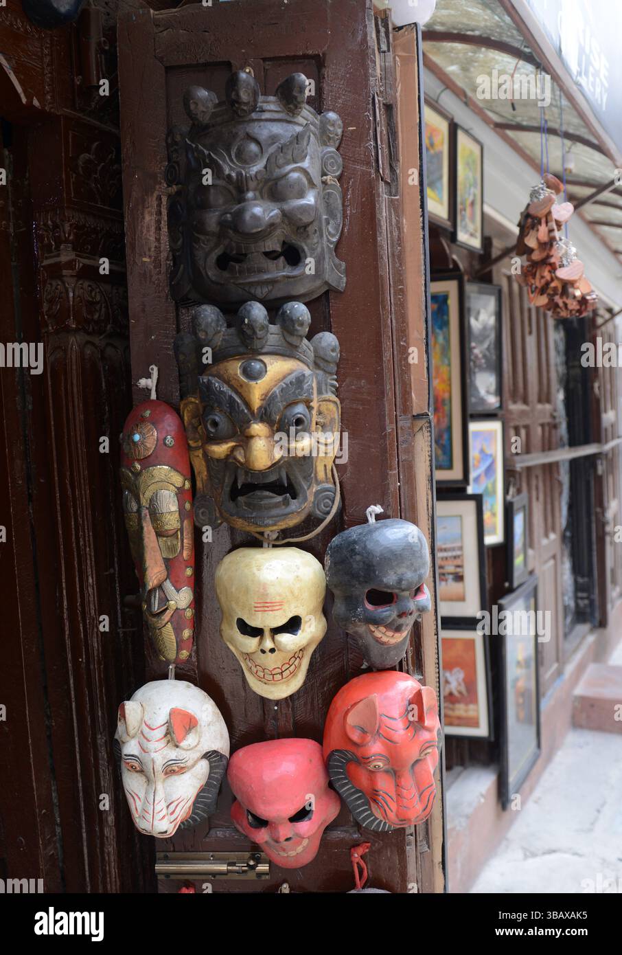 Traditional Tibetan wooden masks displayed at a shop on Freak Street in ...