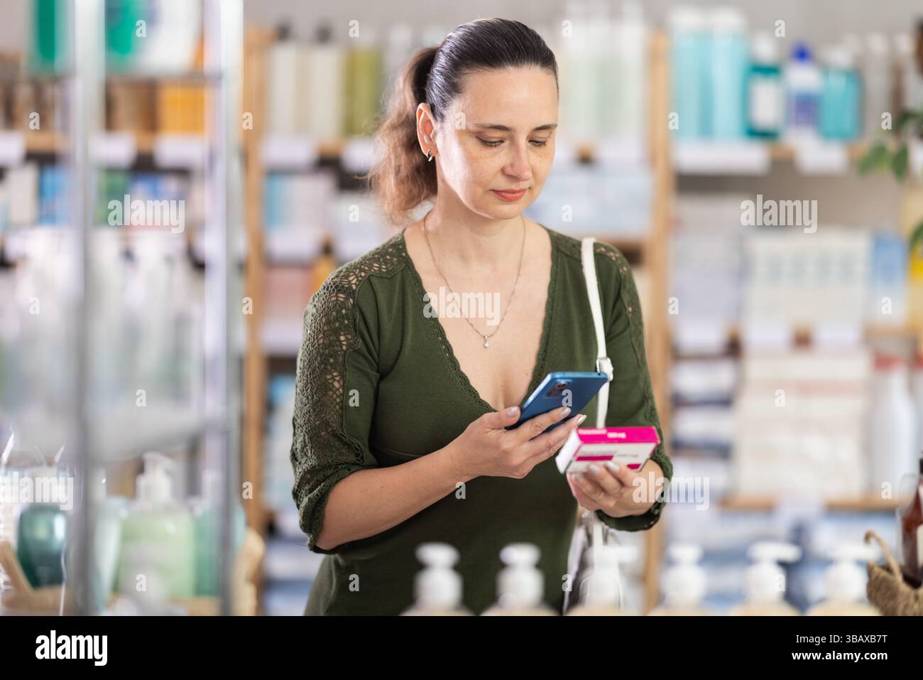 Woman in pharmacy scans QR code tablet paracetamol medication product ...