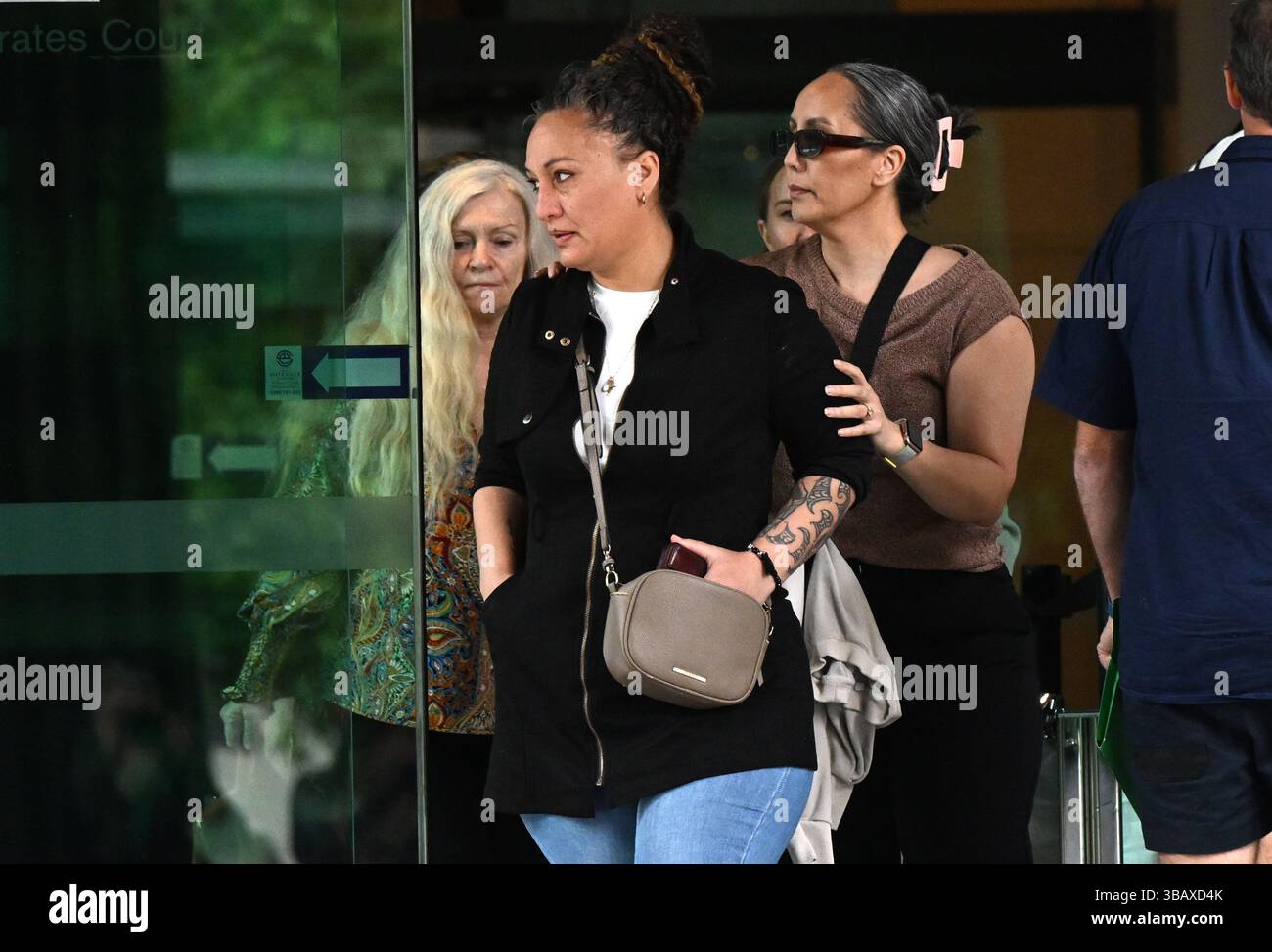 The family and friends of Tia Cameron are seen leaving the Brisbane ...