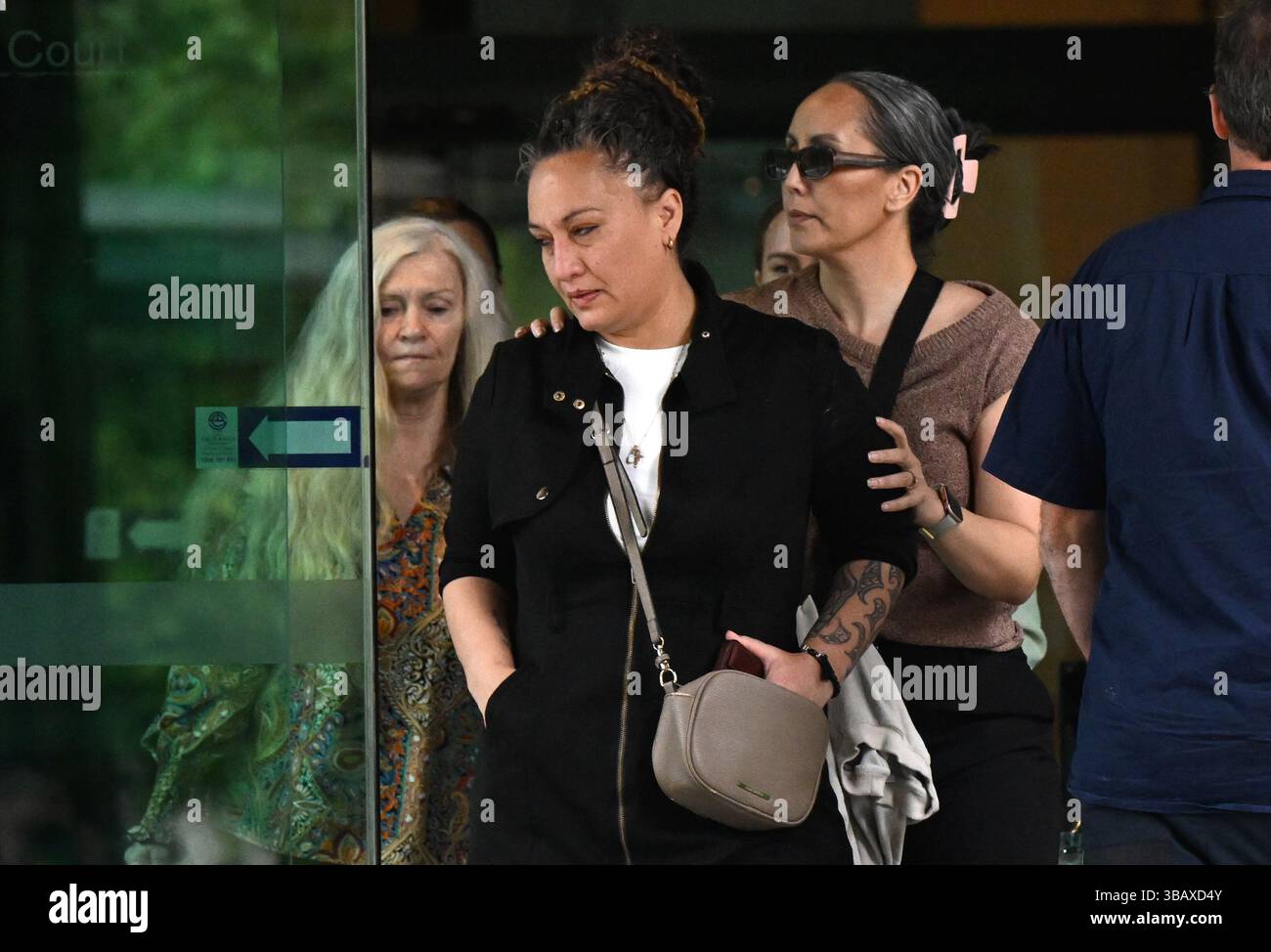 The family and friends of Tia Cameron are seen leaving the Brisbane ...