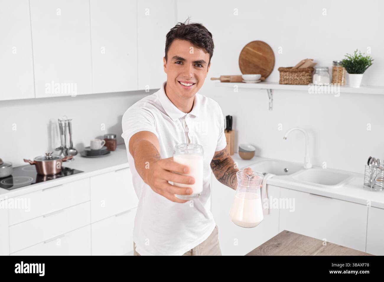 Handsome man jug milk hi-res stock photography and images - Alamy