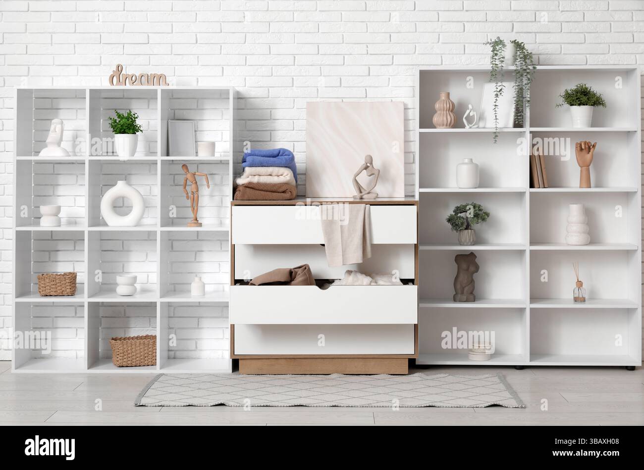 Interior of dressing room with commode, clothes and shelf units Stock ...