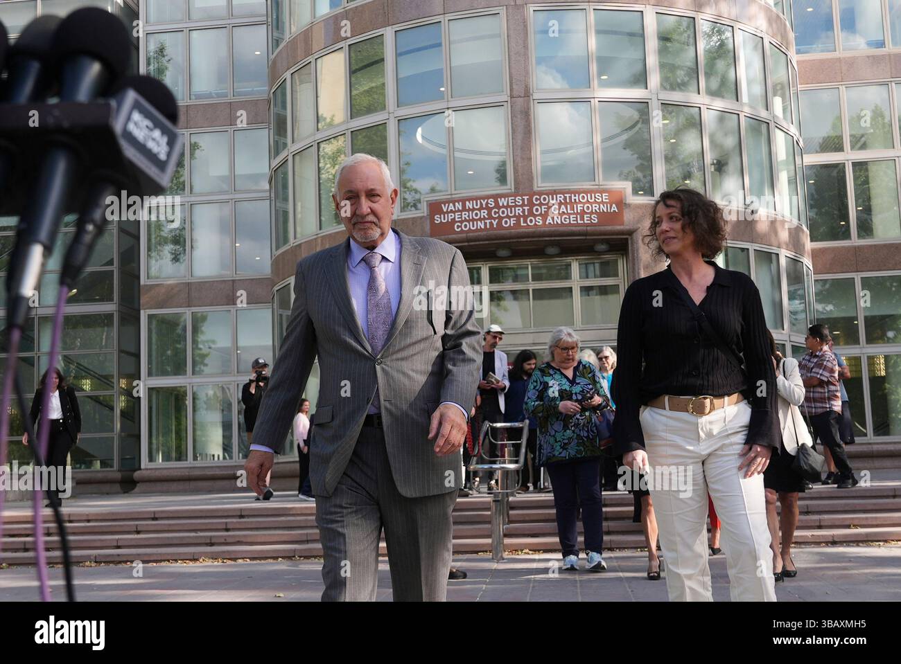 Attorney Mark Geragos, left, representing Erik and Lyle Menendez, walks ...