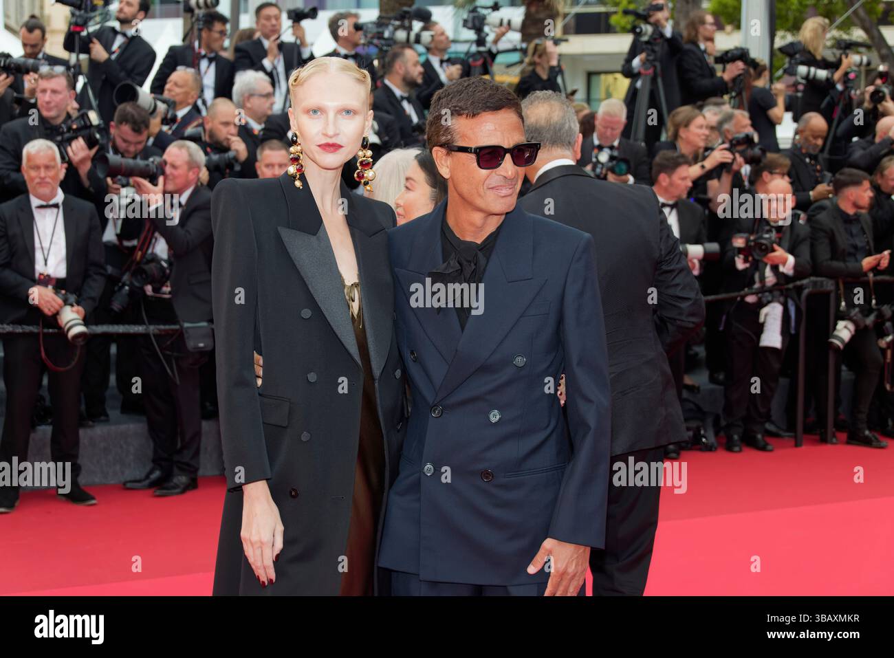 Cannes, France. 13th May, 2025. Yulia Harfouch and Omar Harfouch attend the red carpet of the ...