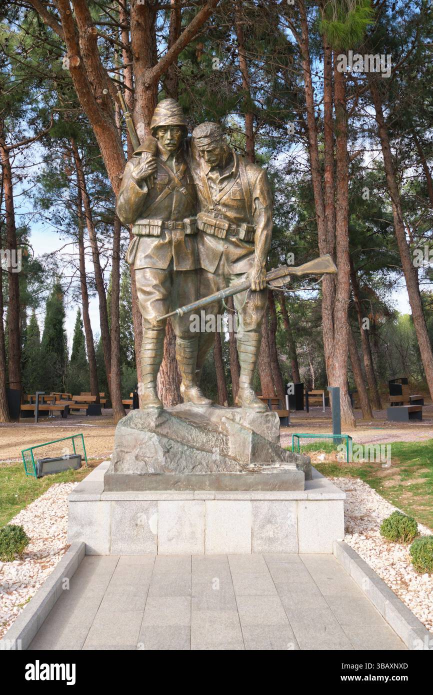 A sculpture of two tired, standing Turkish soldiers with rifle and bandage. At the cemetery ...