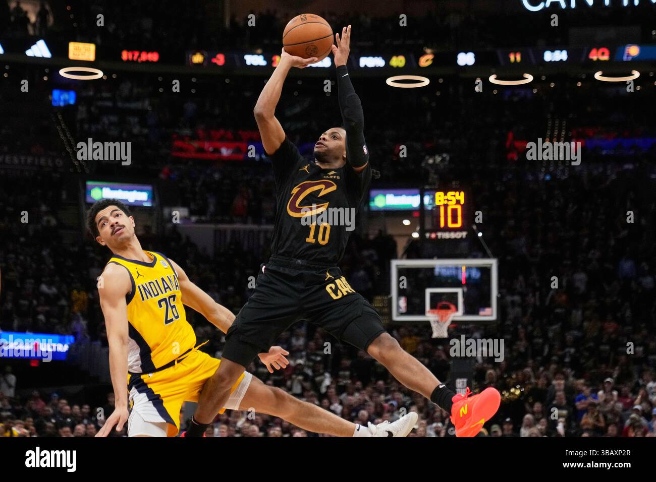 Cleveland Cavaliers guard Darius Garland, right, shoots as Indiana ...