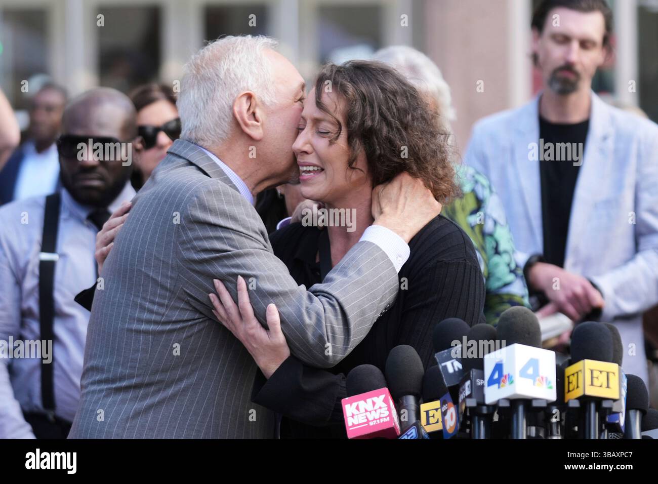 Attorney Mark Geragos, left, hugs Anamaria Baralt, cousin of Erik and ...