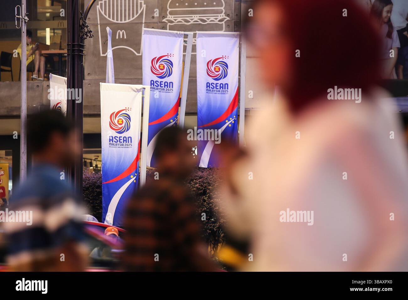 Kuala Lumpur, Malaysia. 12th May, 2025. Pedestrians seen walking past ...