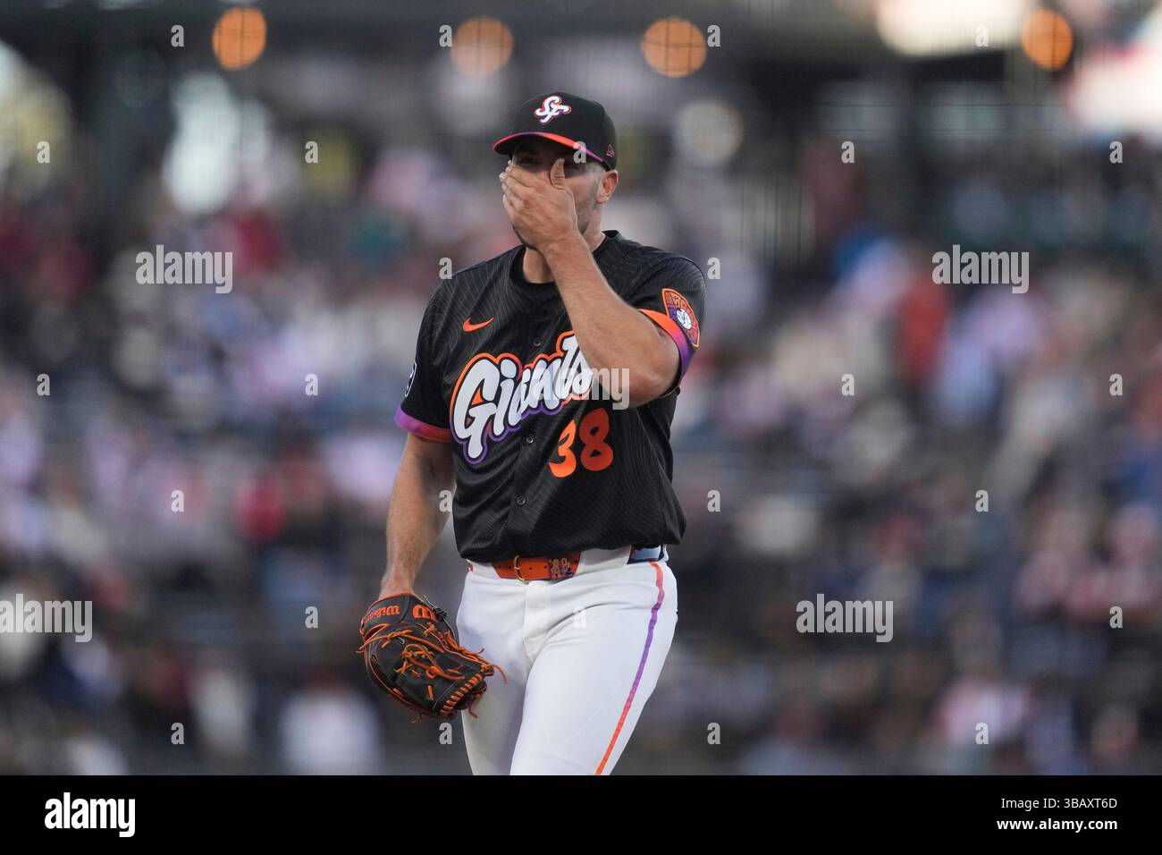 San Francisco Giants pitcher Robbie Ray reacts after a mound visit by ...