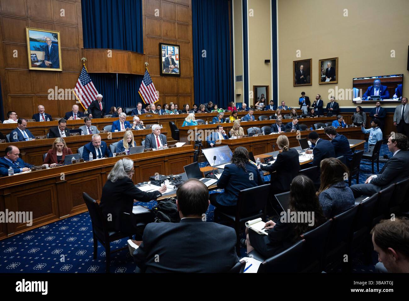 House Energy and Commerce Committee members and staffers are seen ...