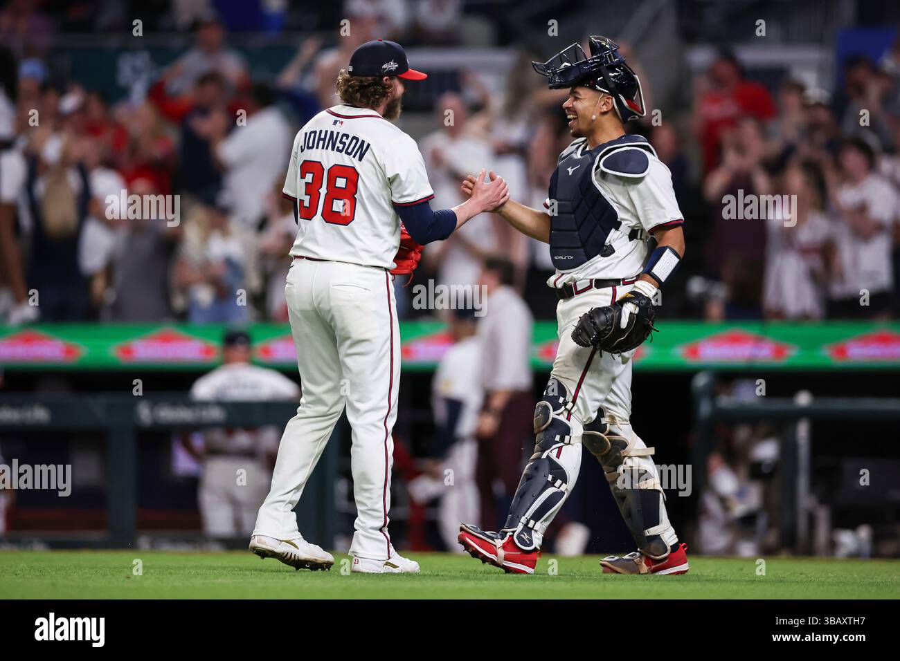 Atlanta Braves pitcher Pierce Johnson (38) high-fives catcher Drake ...