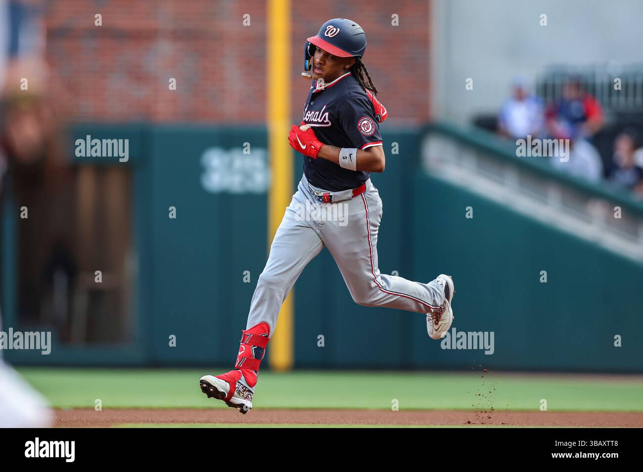 Washington Nationals' CJ Abrams runs the bases after hitting a solo ...