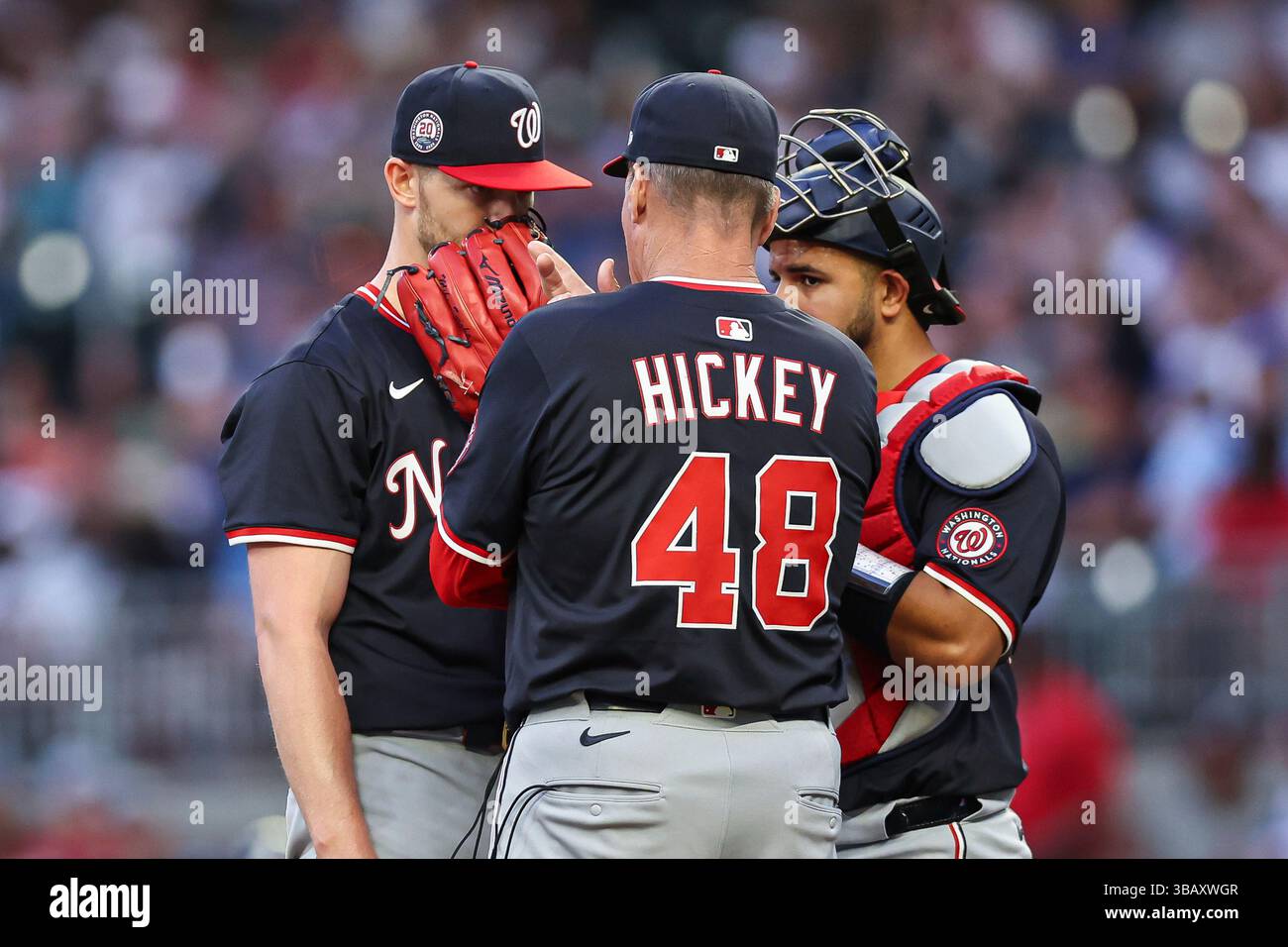 Washington Nationals pitcher Michael Soroka, left, talks to pitching coach Jim Hickey (48) and ...