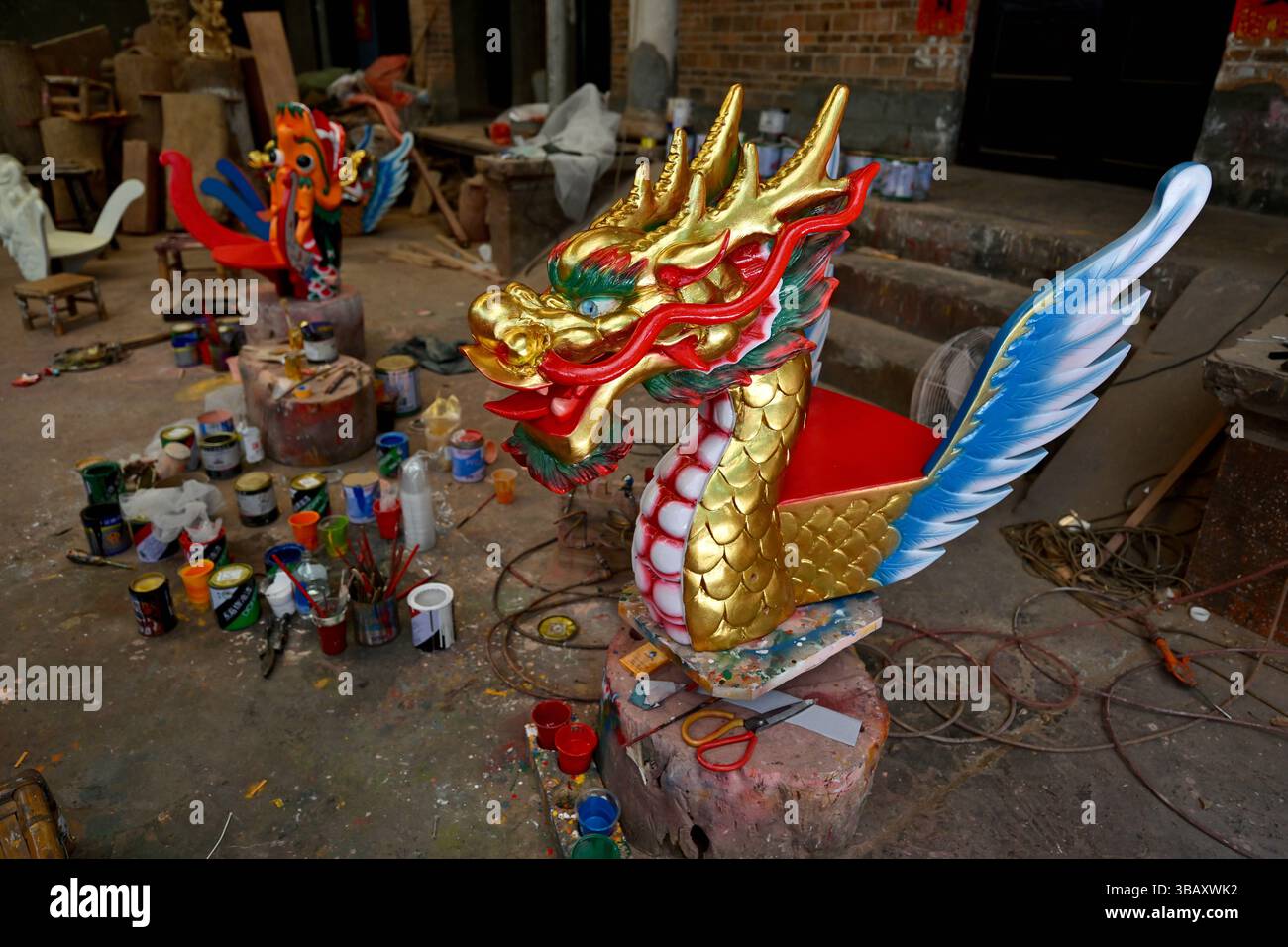 Fuzhou,China.12th May 2025. A dragon head of dragon boat is about to be ...