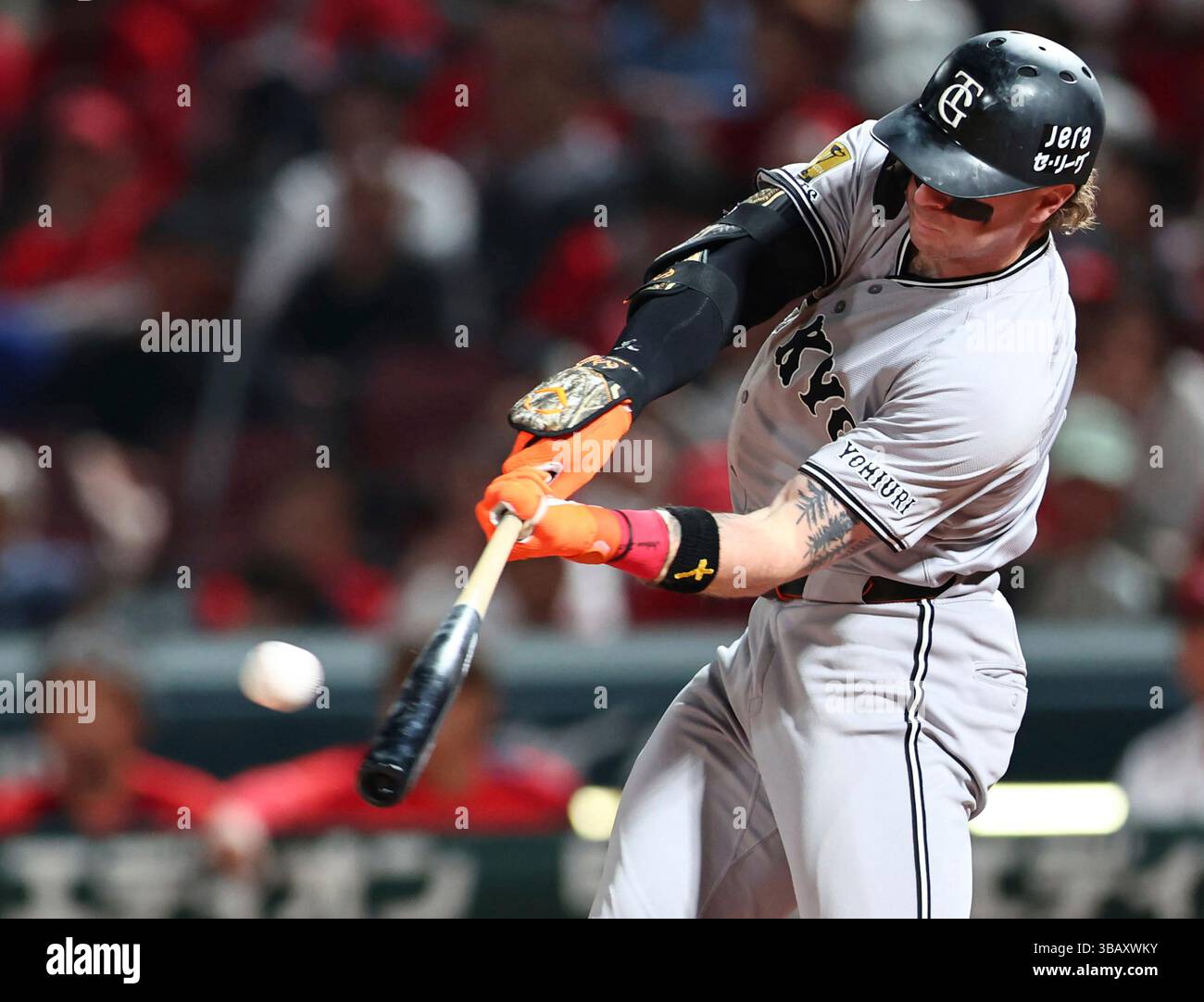Yomiuri Giants right fielder Trey Cabbage hits a two-run home run in ...