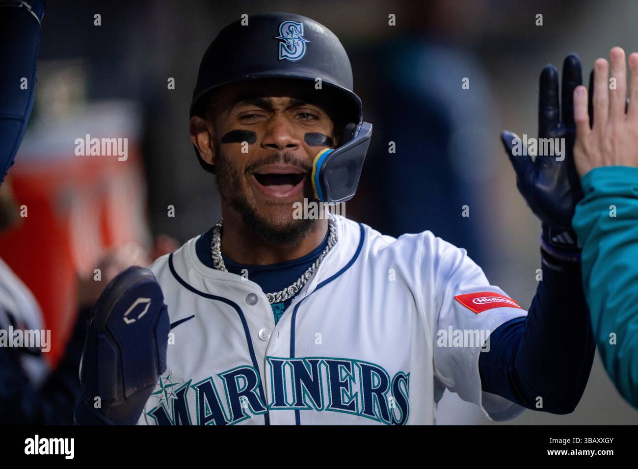 Seattle Mariners' Julio Rodriguez celebrates in the dugout after ...