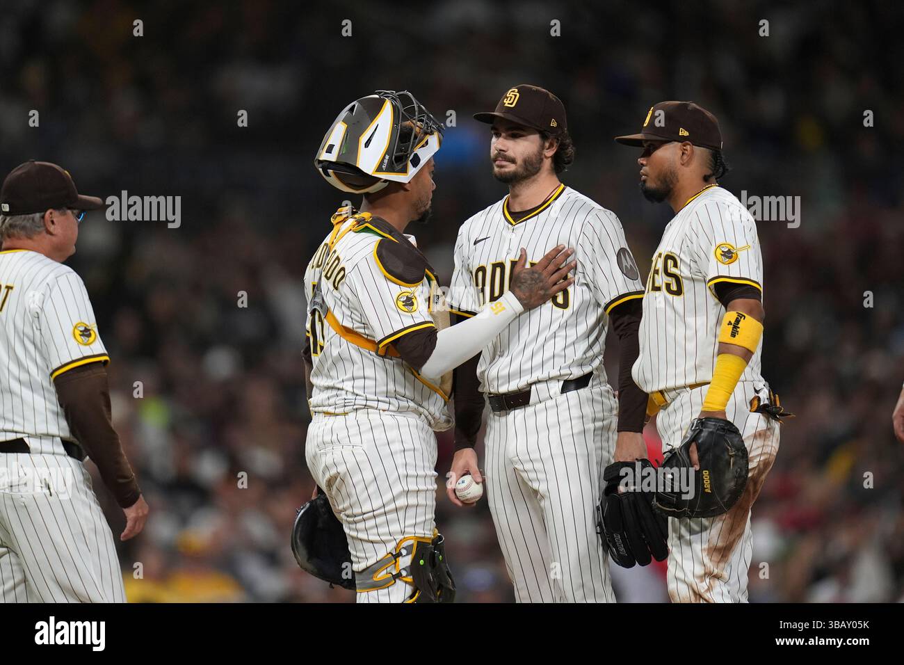 San Diego Padres catcher Martin Maldonado, center, pats starting ...