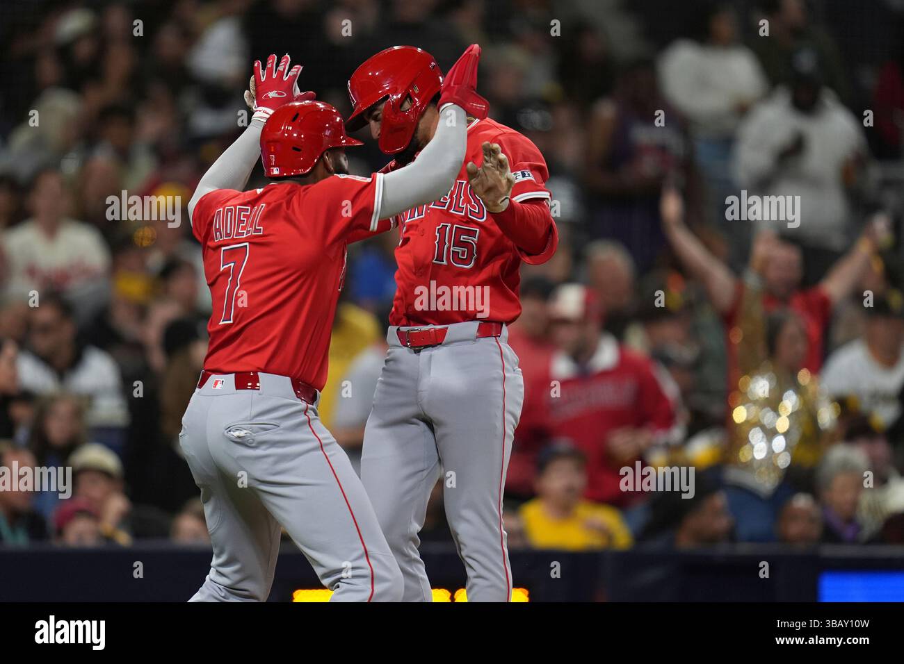 Los Angeles Angels' Matthew Lugo (15) celebrates with teammate Jo Adell ...
