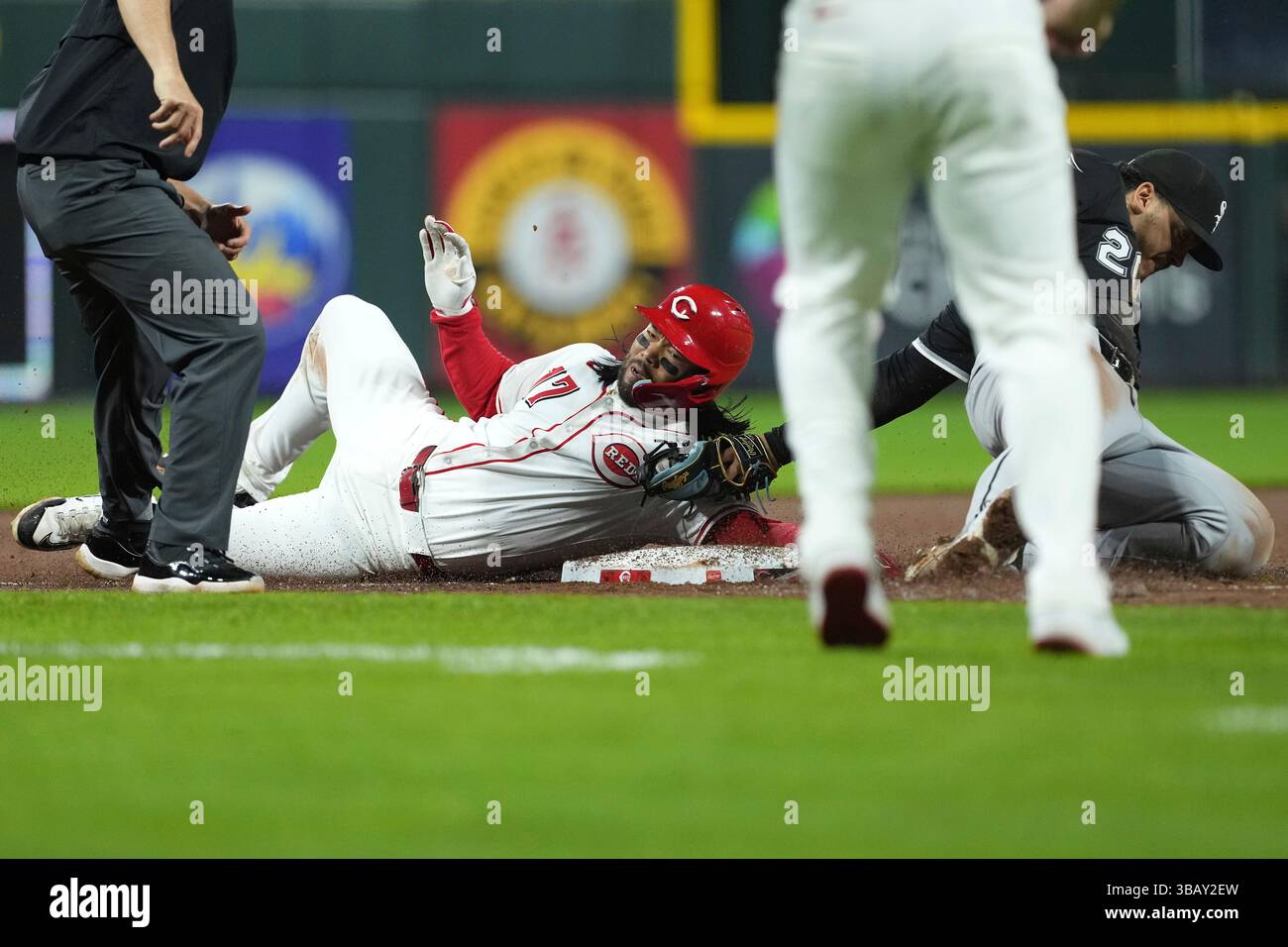 Cincinnati Reds' Connor Joe is tagged out stealing third base by ...