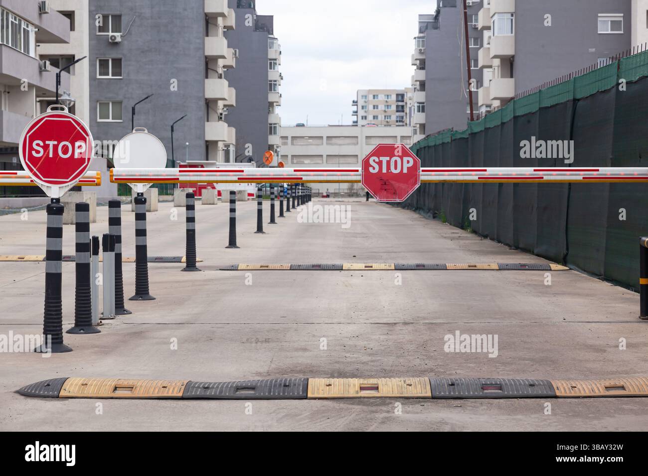 Closed private road access with stop signs and Stock Photo - Alamy