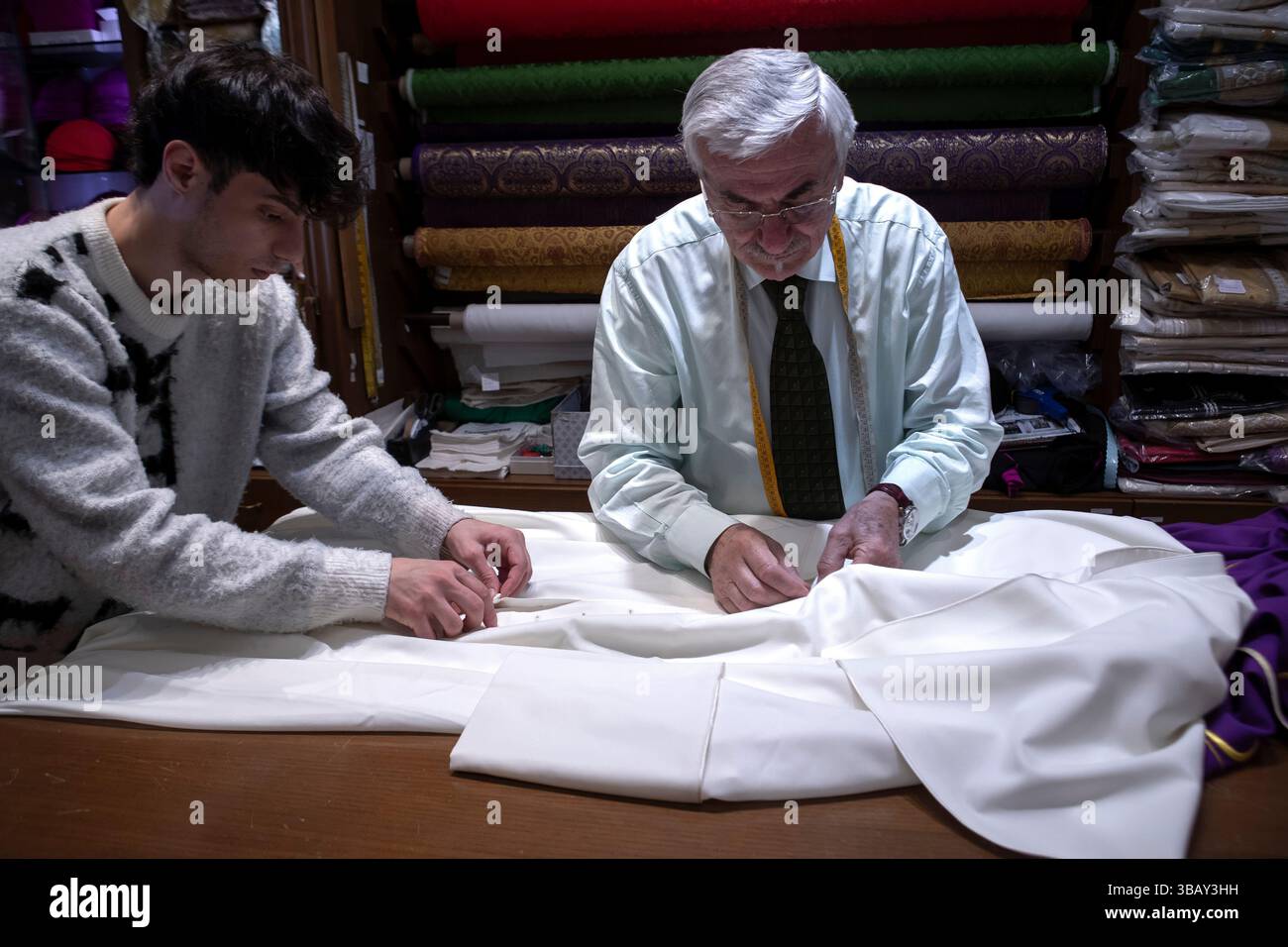 Tailor Raniero Mancinelli and his nephew Lorenzo Di Toro, make the ...