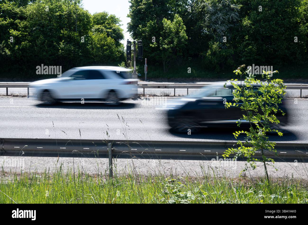 Cars at speed, blurred, on the M40 motorway, Warwickshire, UK Stock ...
