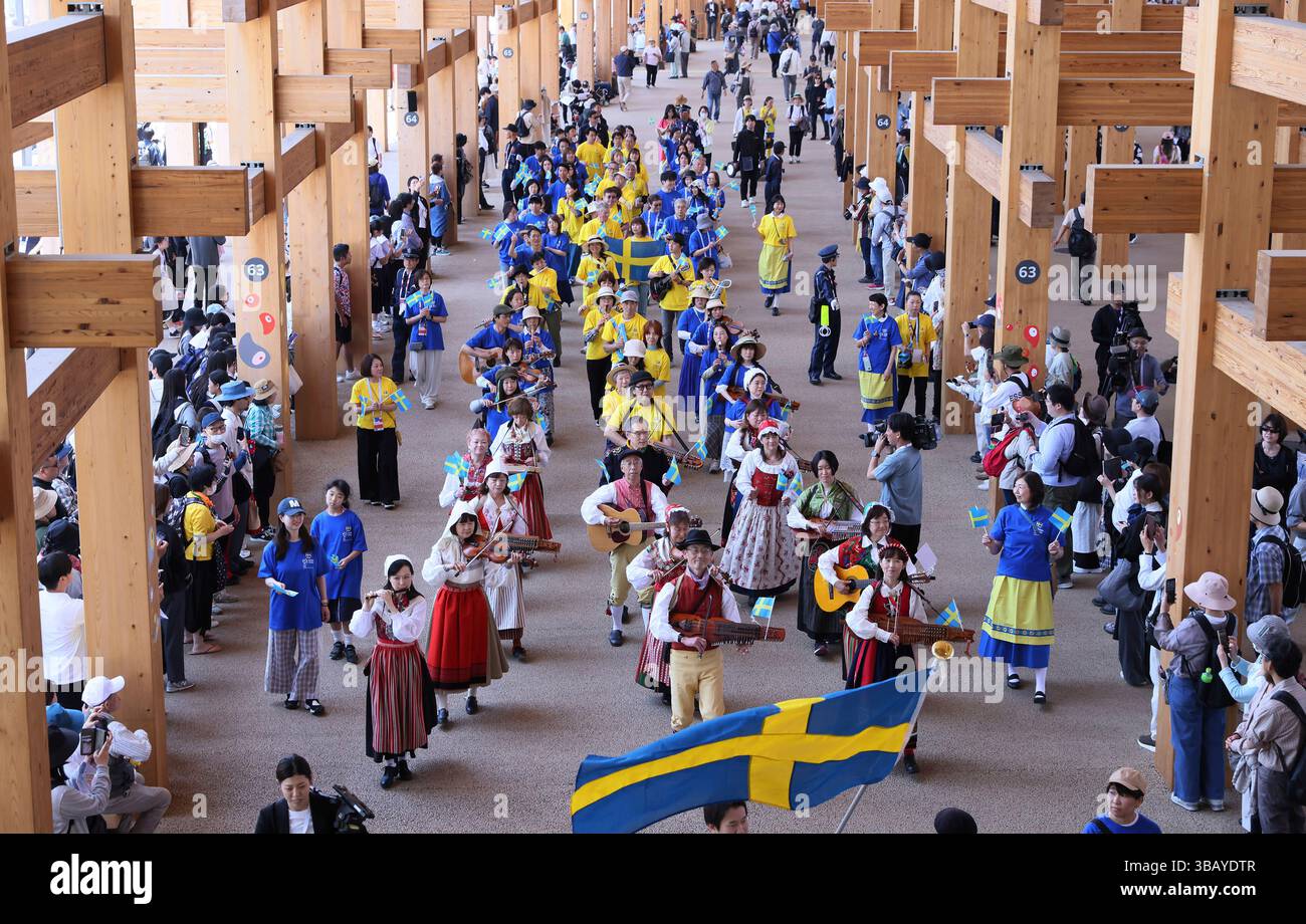 Many attendees, clad in traditional Swedish costumes and blue or yellow ...
