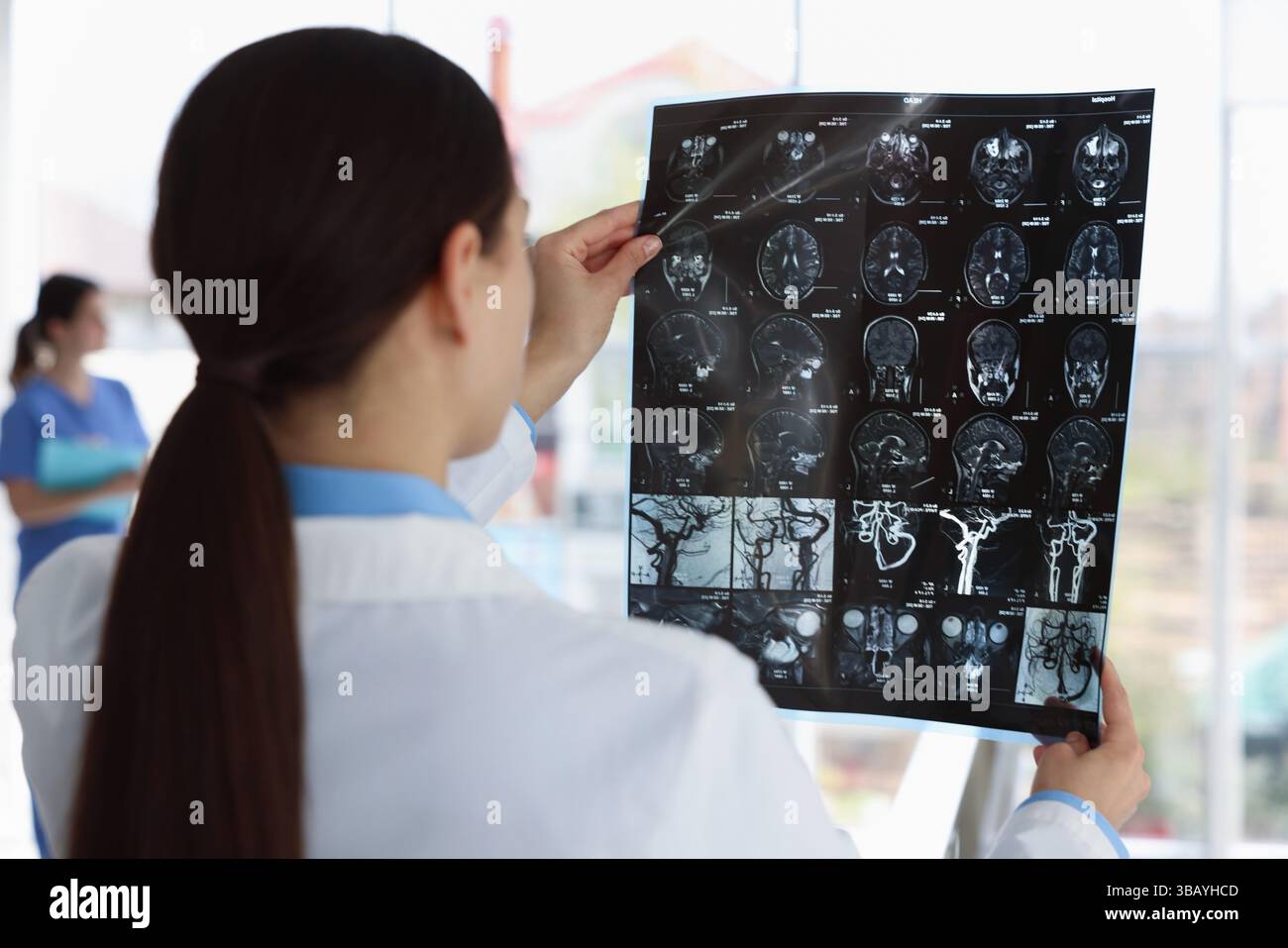 Doctor examining MRI scan in hospital, back view Stock Photo - Alamy