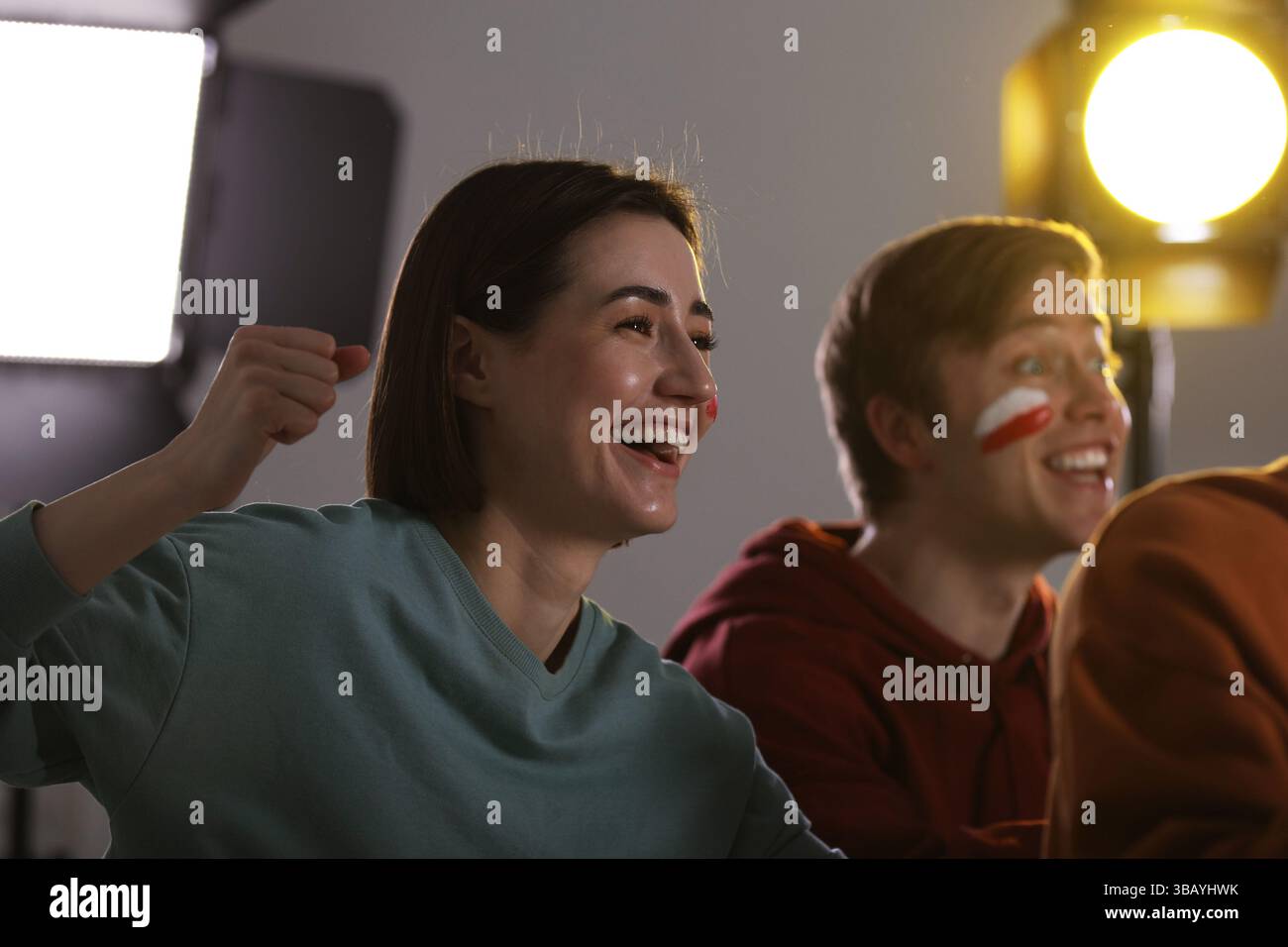 Emotional sports fans watching game together indoors Stock Photo - Alamy