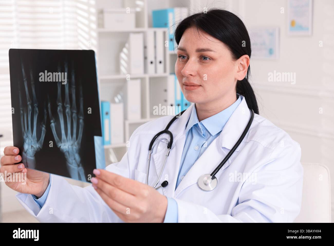 Doctor examining hand MRI scan in clinic Stock Photo - Alamy