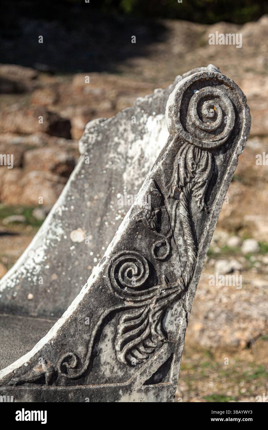 Ancient marble seats with ornate carvings at the Amphiareion of Oropos ...