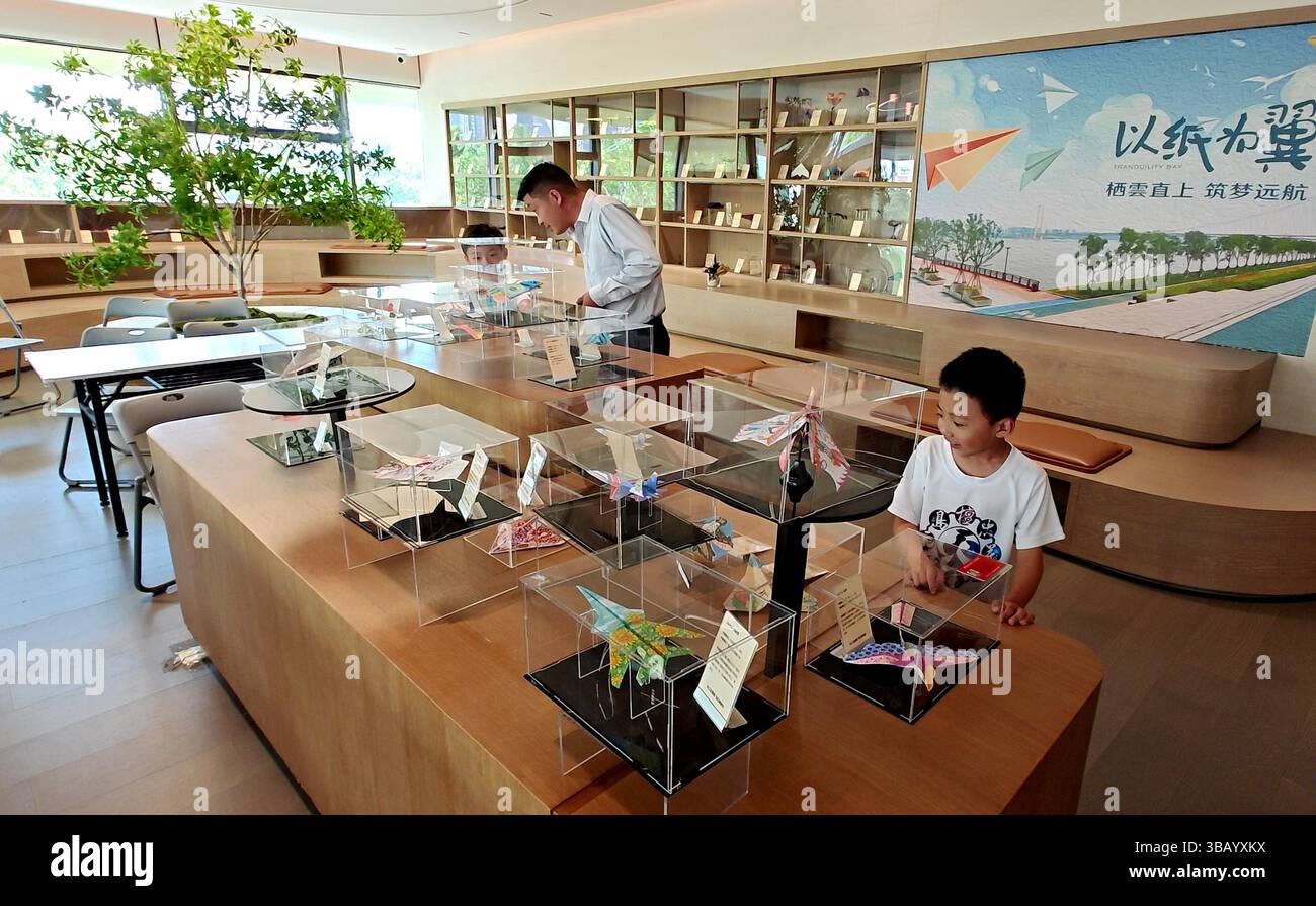 People visit a paper airplane museum in Wuhan City, central China's ...